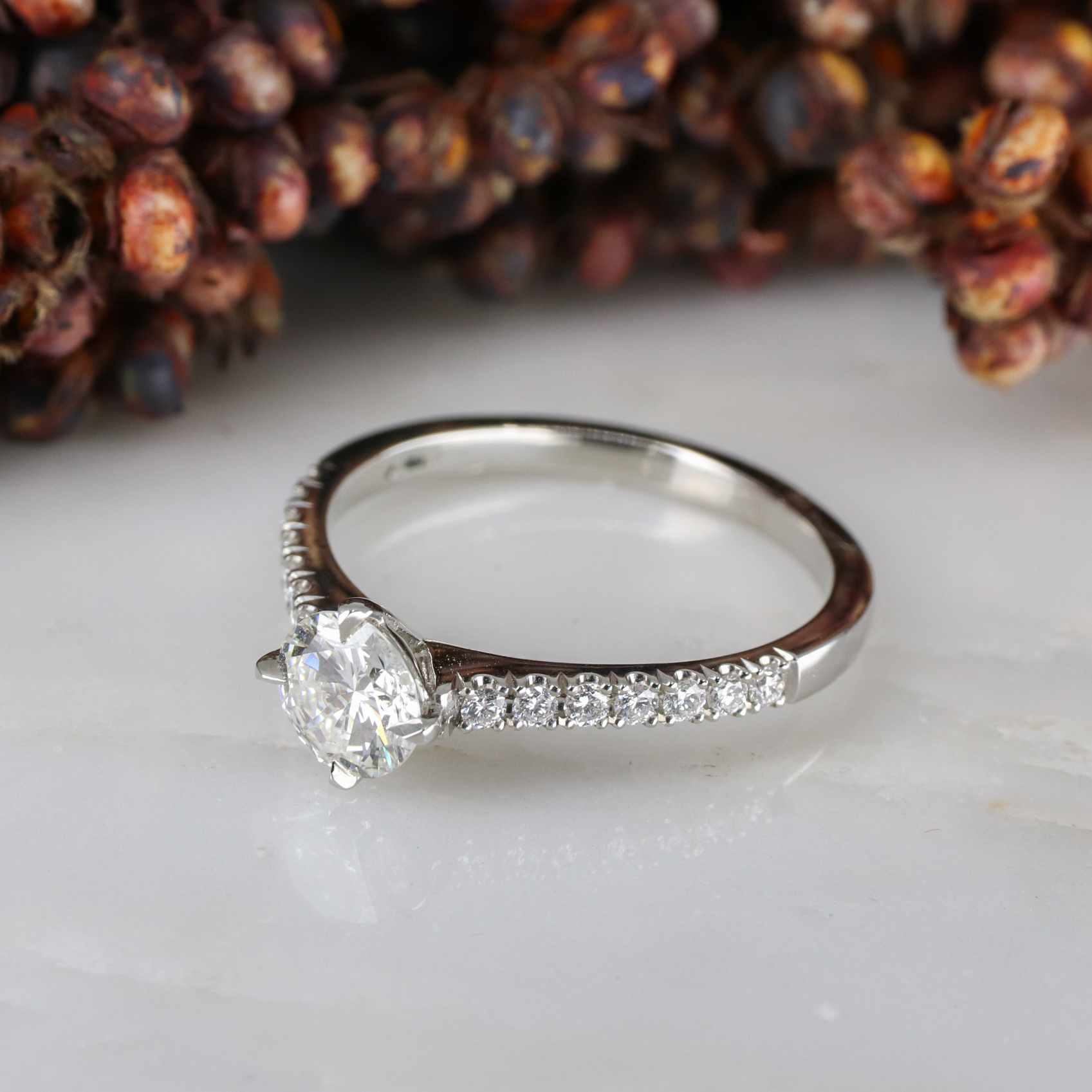 Platinum compass set solitaire ring with round brilliant cut white ...