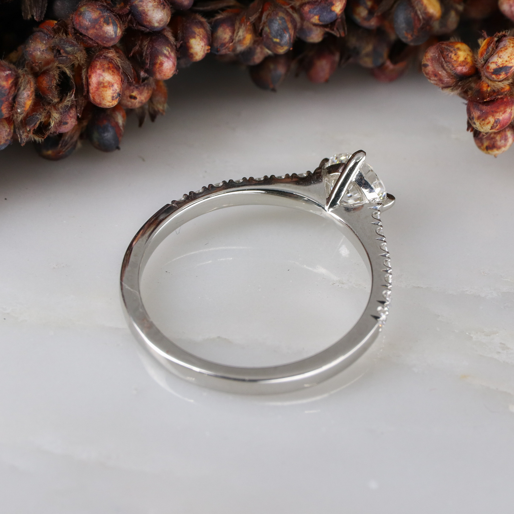 Platinum compass set solitaire ring with round brilliant cut white ...