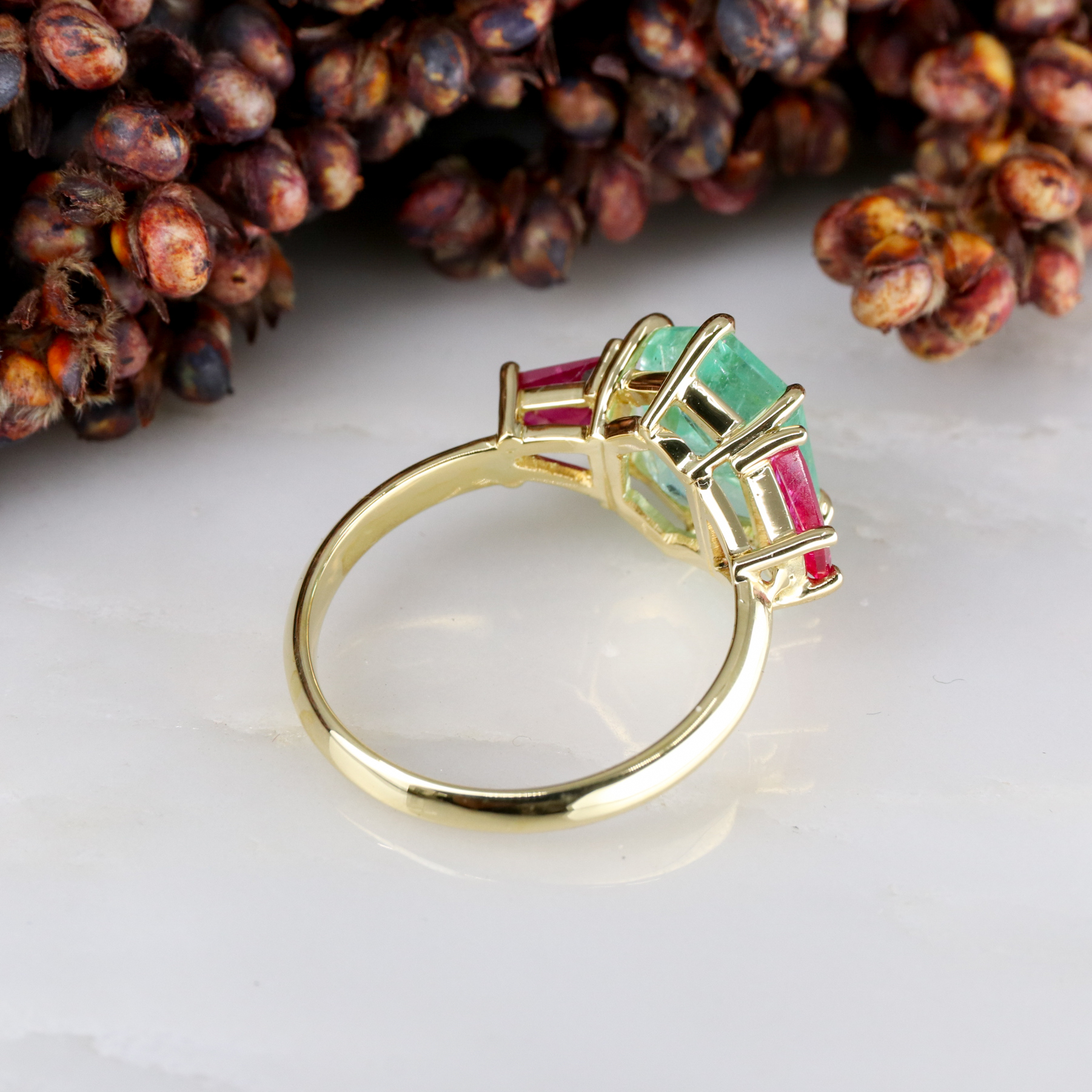 18ct yellow gold trilogy ring with hexagon pale green beryl centre and ...