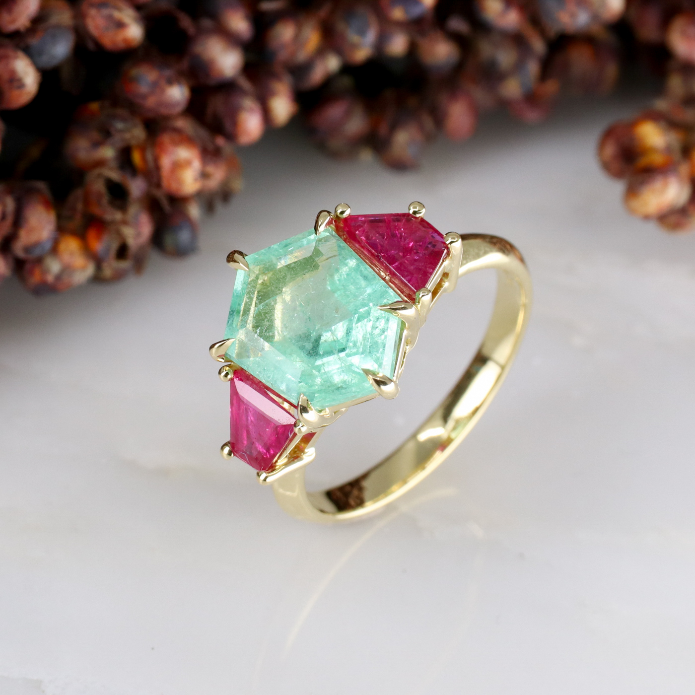 18ct yellow gold trilogy ring with hexagon pale green beryl centre and ...