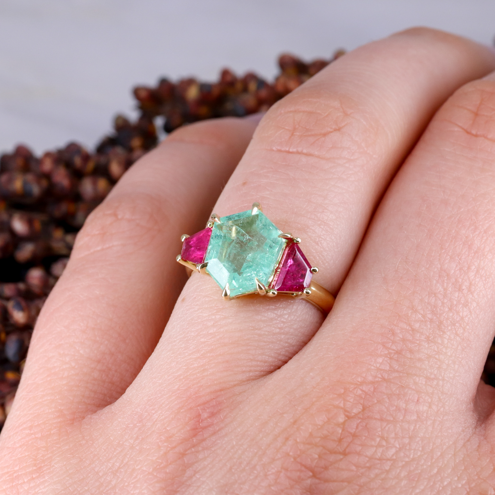 18ct yellow gold trilogy ring with hexagon pale green beryl centre and ...