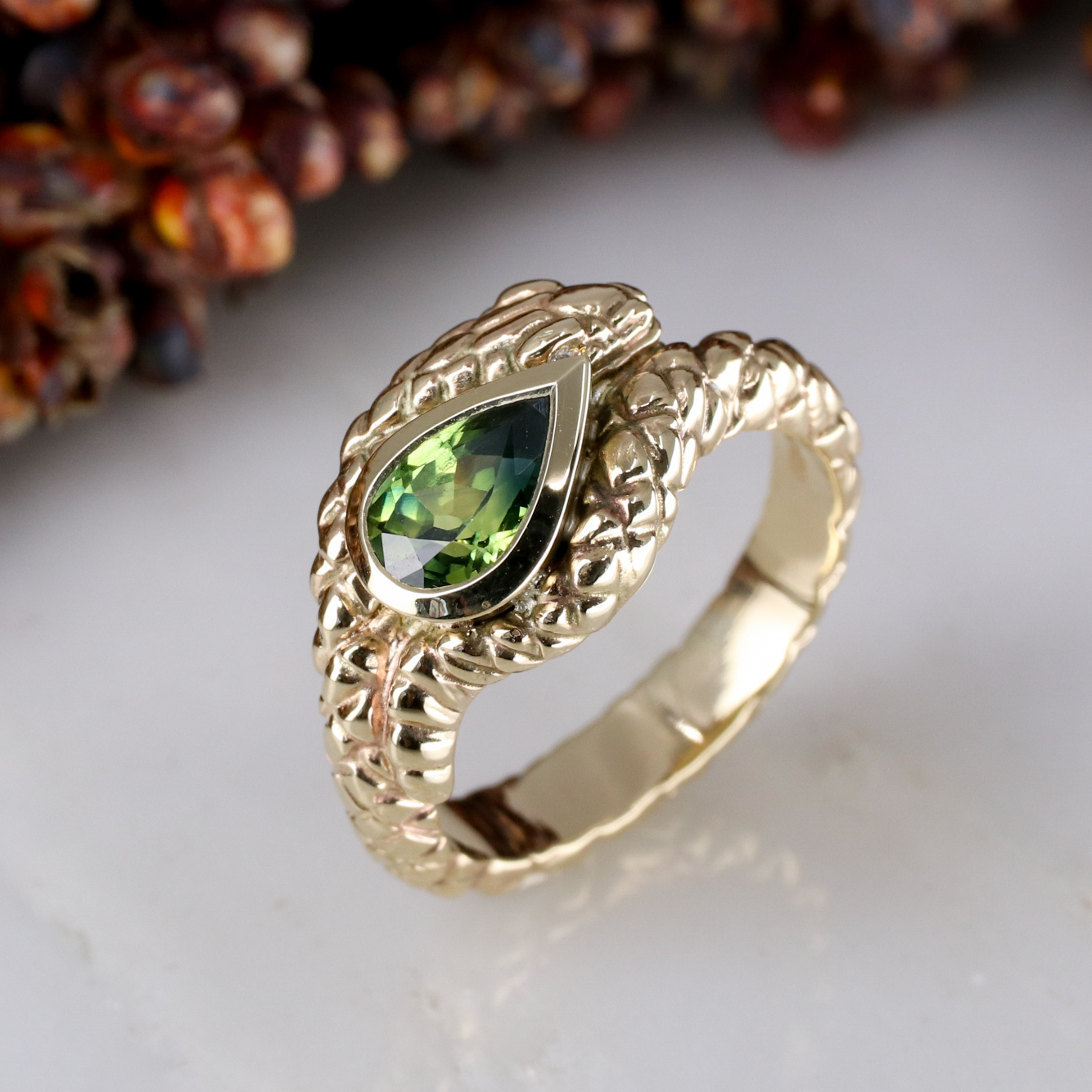9ct yellow gold Coiled Snake engagement ring with pear shaped green ...